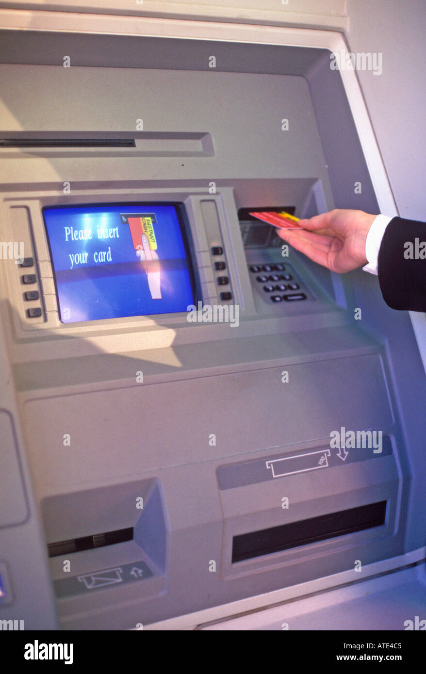 woman s hand using an atm banking machine Stock Photo - Alamy