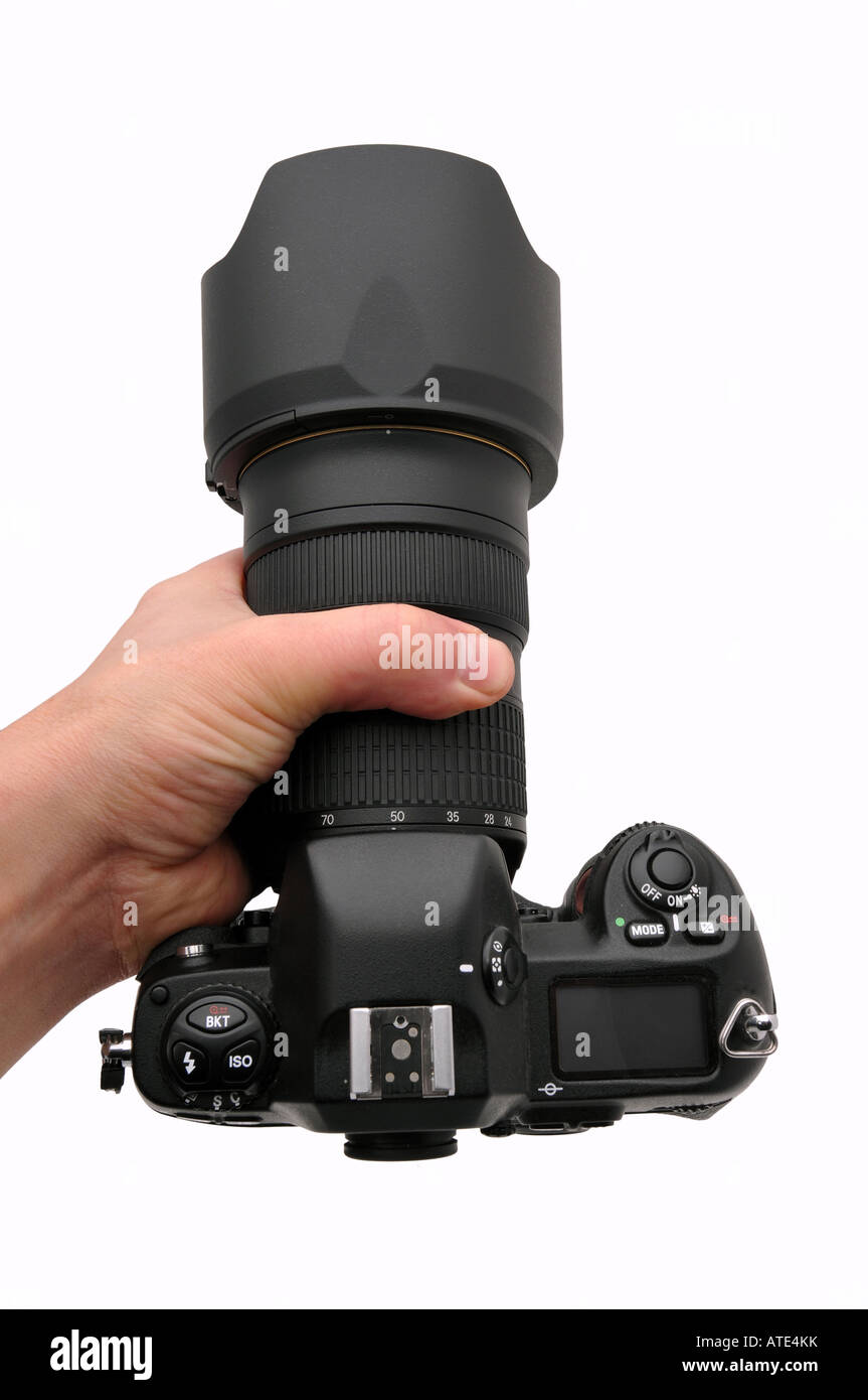 Camera in hand over white Stock Photo - Alamy