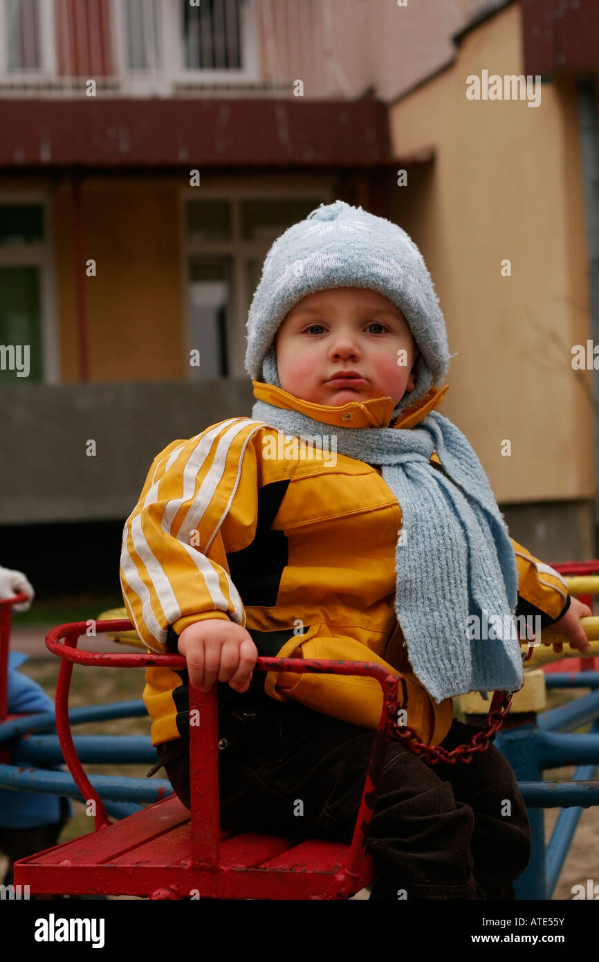 Children Playing on Merry-go-round in park Stock Photo - Alamy