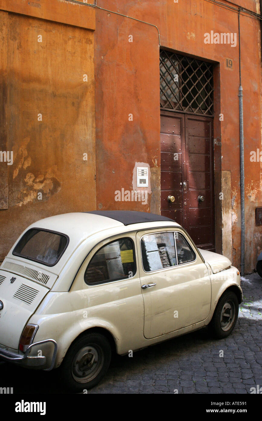 White Fiat 500 parked in an old street in Rome Italy Stock Photo - Alamy