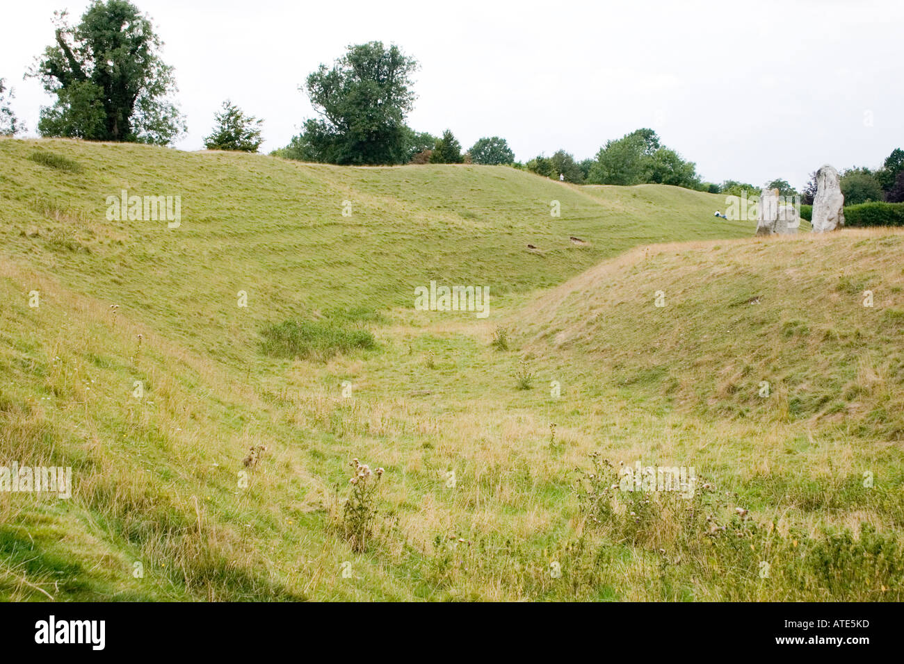 Dry moat and earthwork surrounding Avebury stone circle Wiltshire UK ...
