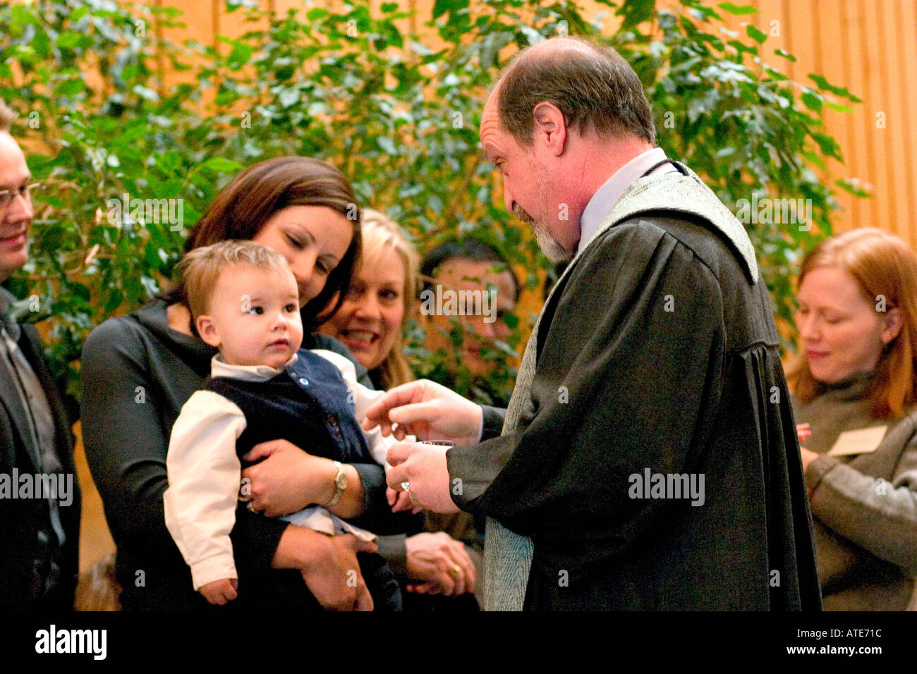 Minister performing Naming Ceremony for children in the sanctuary of ...
