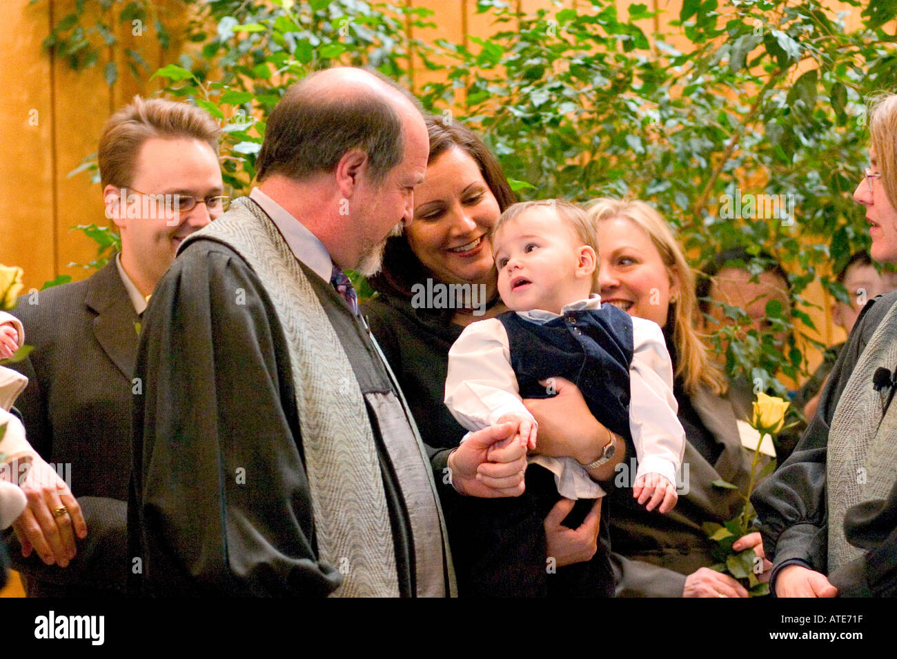 Minister performing Naming Ceremony for children in the sanctuary of ...
