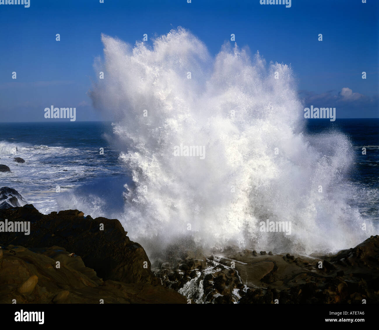 Huge Pacific Ocean surf breaks against the rocky shoreline of the ...