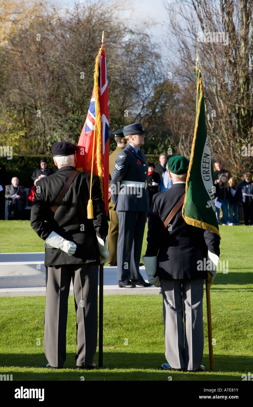 Two war veterans (ex-servicemen) holding standards & armed forces ...