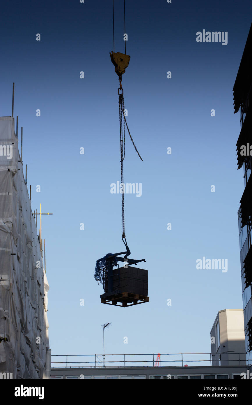 Building blocks on a pallet being lifted by a crane Stock Photo - Alamy