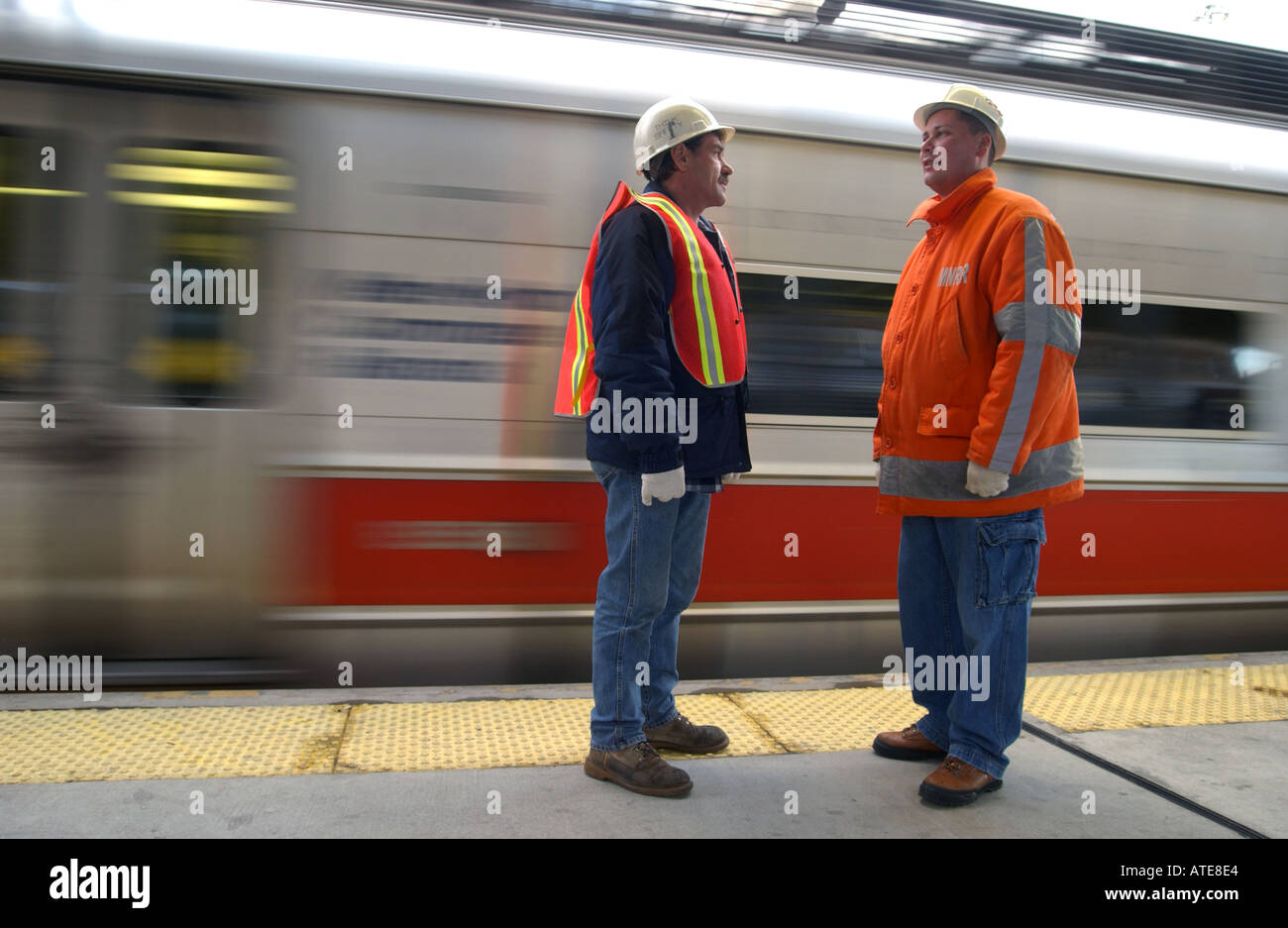 Security train workers engineers with Metro North train blurring by ...