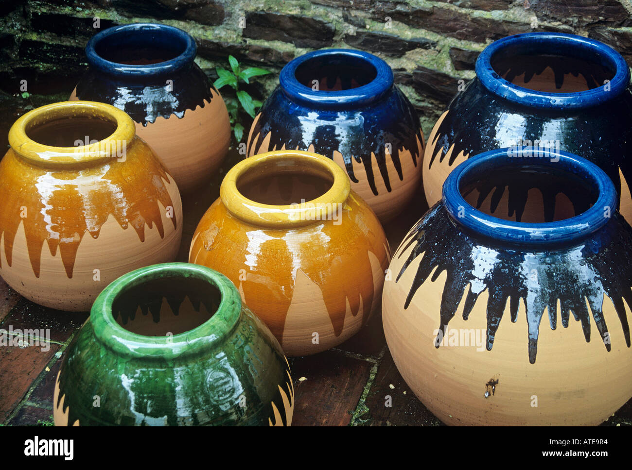 A collection of coloured clay pots on one of the many pottery stalls ...