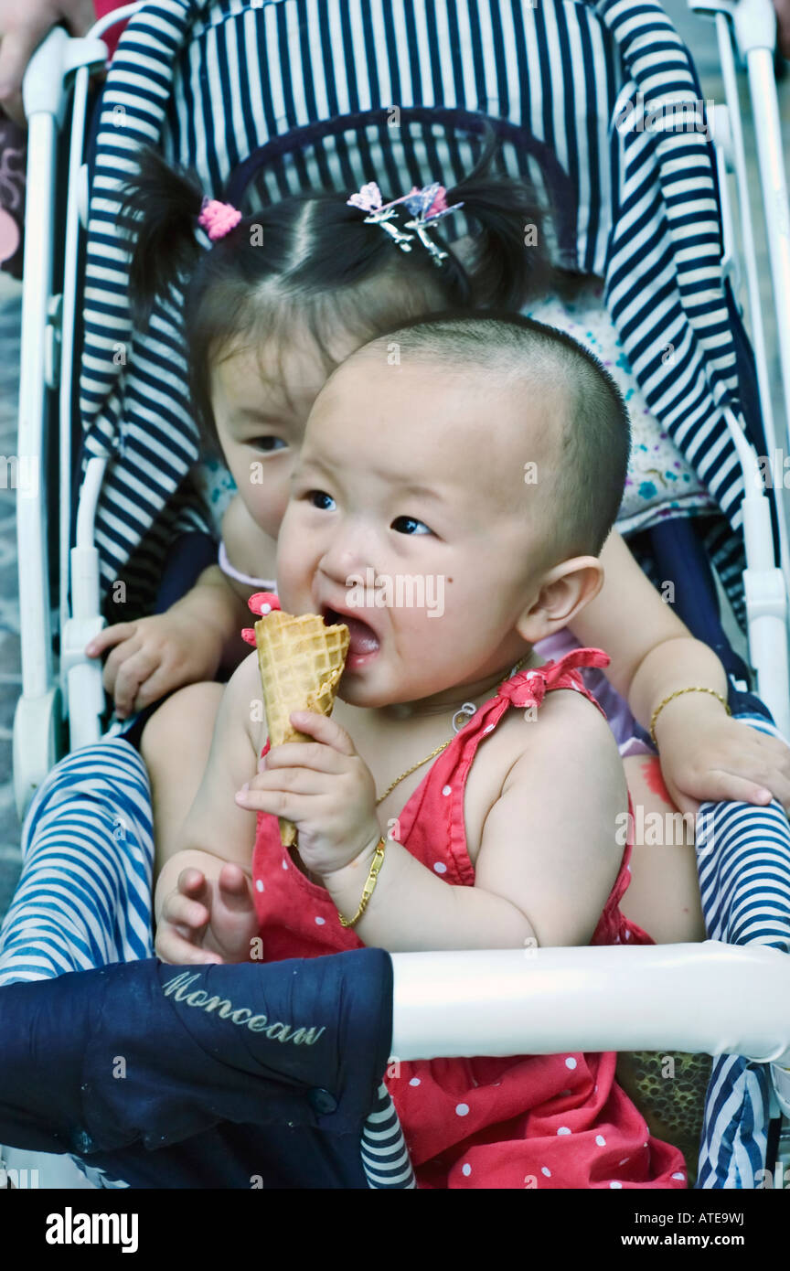 France, Shopping Chinese Children Eating Ice Cream Asian Infant in Baby ...
