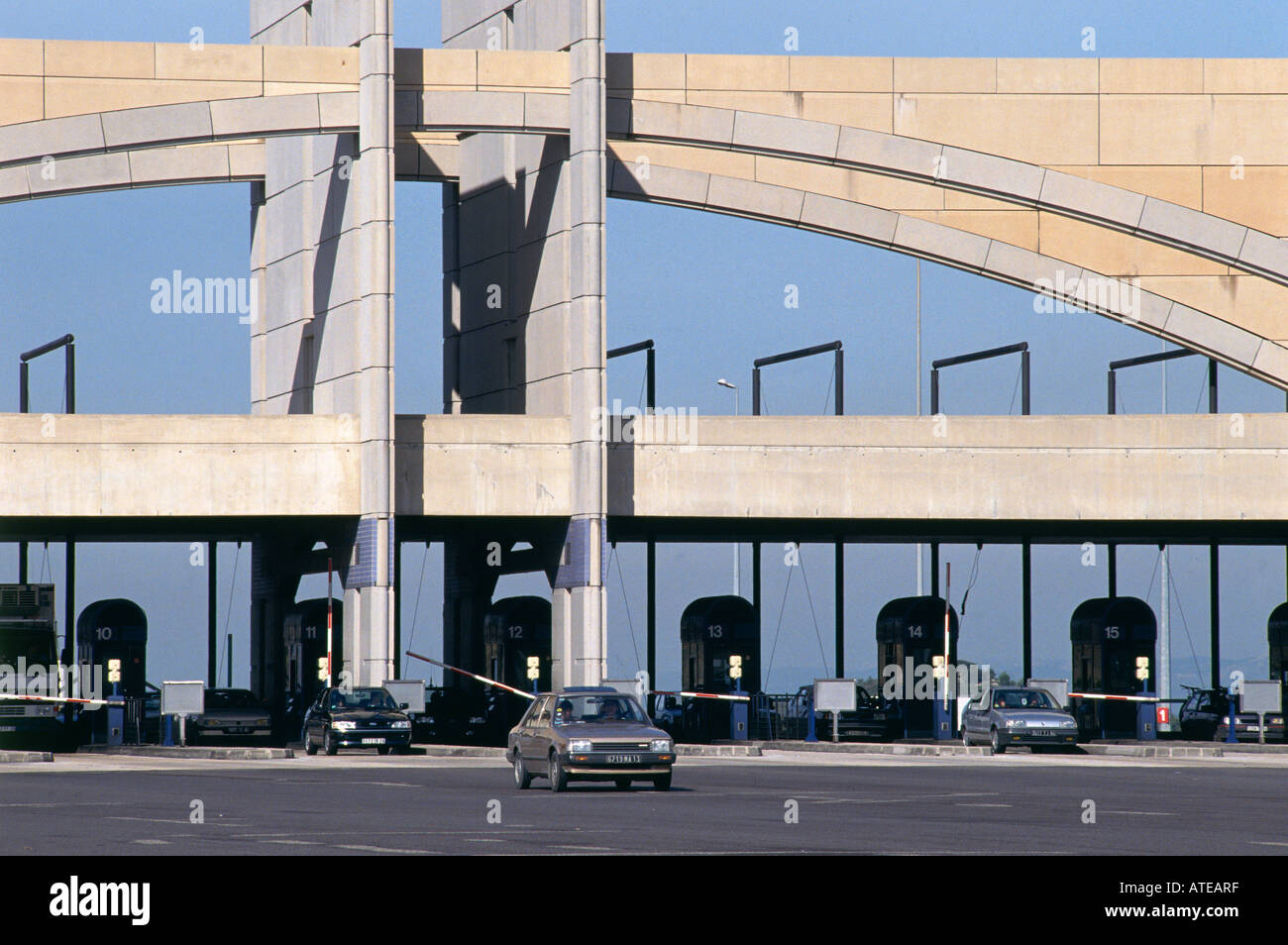 Vehicles emerging from some of the péages toll booths located at ...