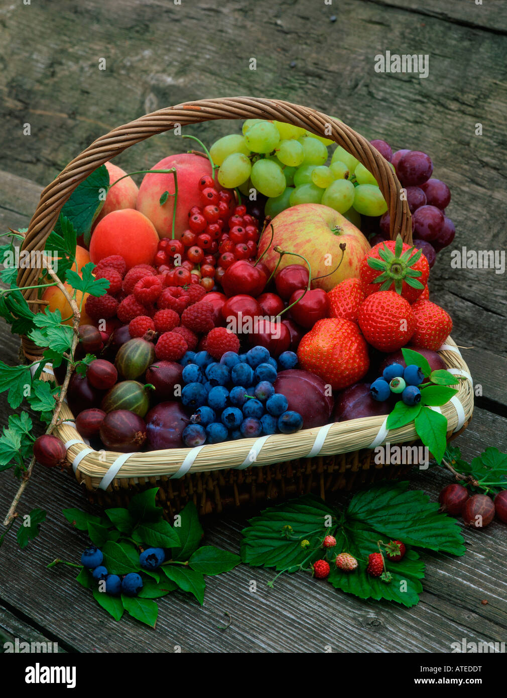 Basket with fruit and berries Stock Photo - Alamy