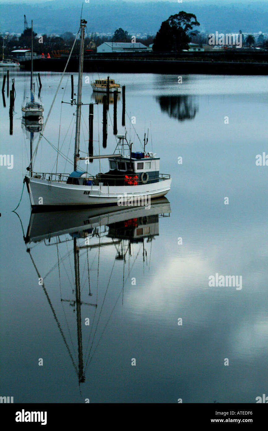 A reflection of a boat on the mouth of the Tamar River Launceston ...