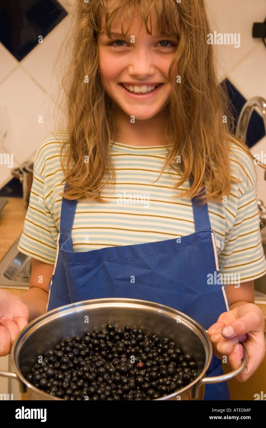 Girl with blueberries Stock Photo - Alamy