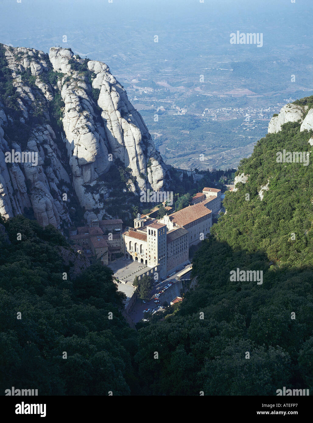 The red tiled roof of the Monastery of Montserrat is set high up in the ...