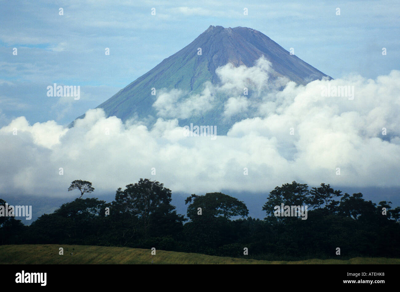 A view of the giant active volcano of Arenal seen from a distance over ...