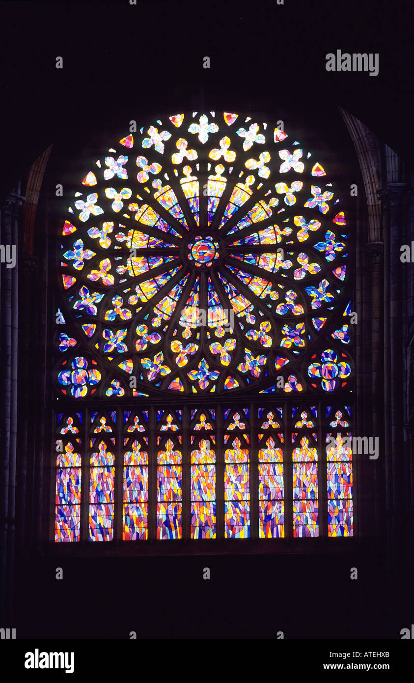 Light streams in through the colourful and huge rose window of the St ...