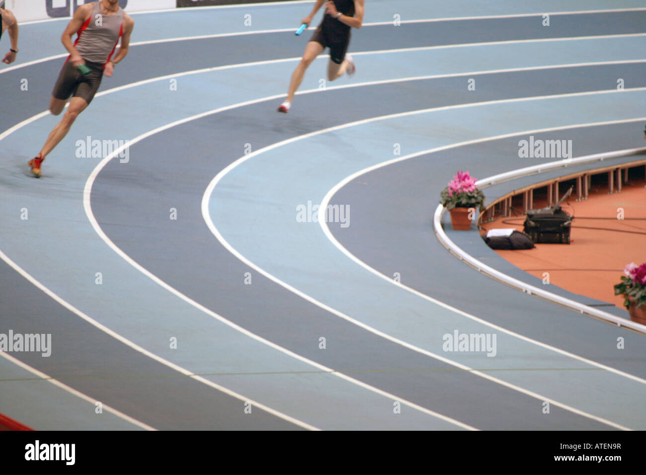 men indoors relay race sports and athletics concepts Stock Photo - Alamy