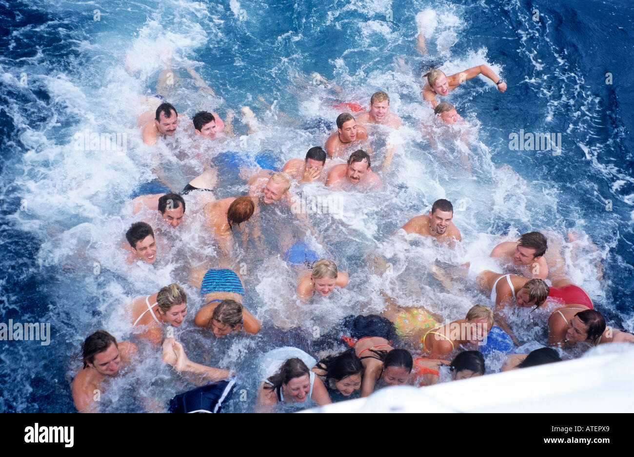 Boom netting with swimmers in water behind boat Whitsunday Islands ...