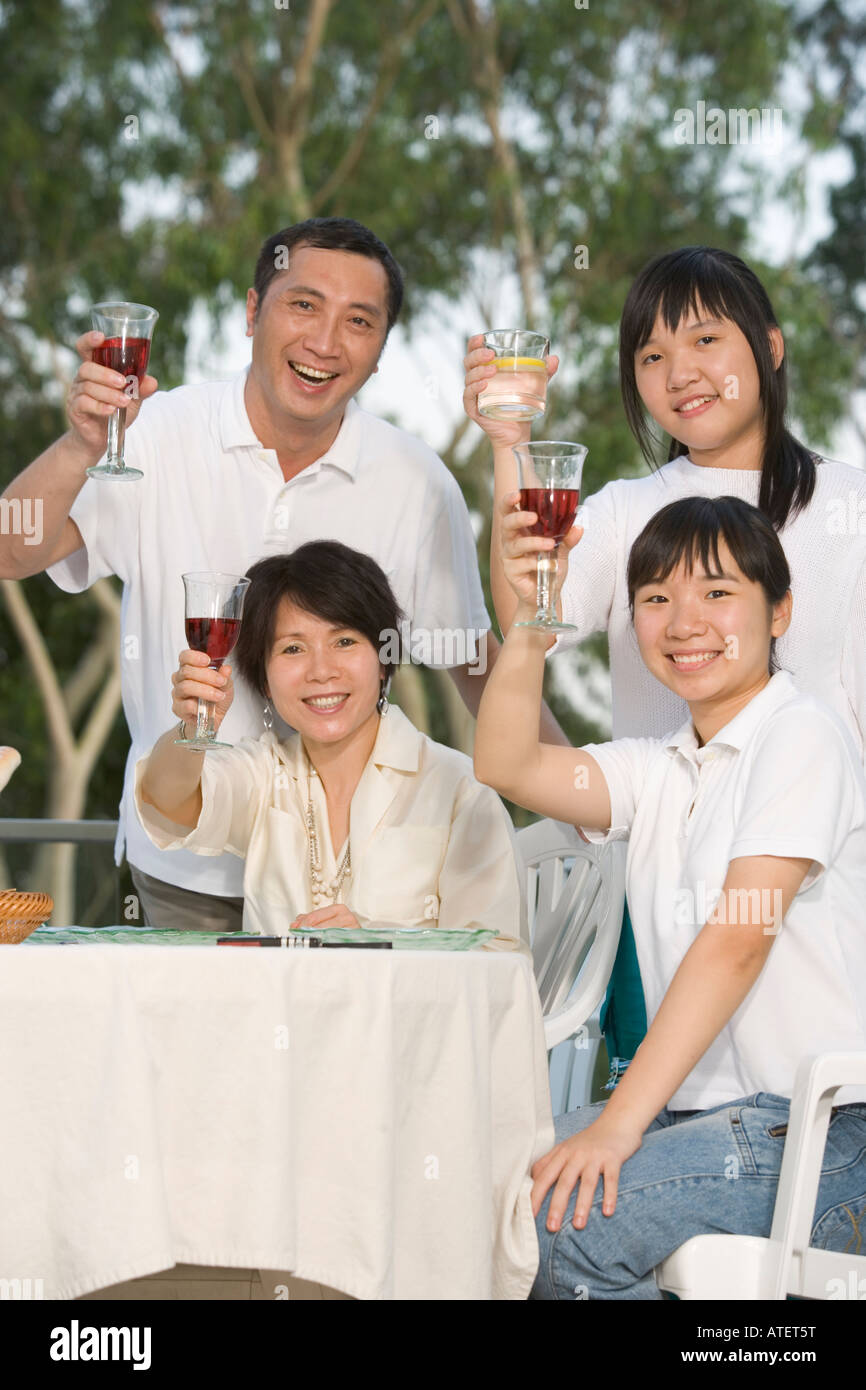 Portrait of parents and their two daughters toasting with wine Stock ...