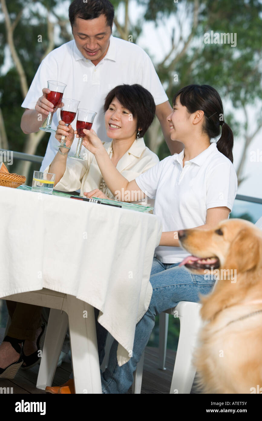 Portrait of parents and their two daughters toasting with wine Stock ...