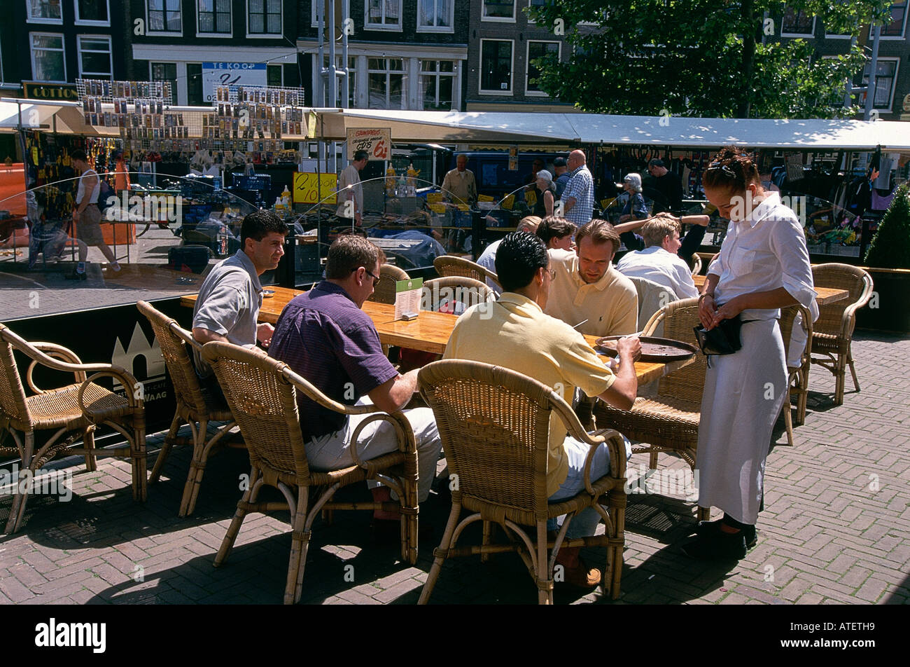 A waitress serving at an outdoor cafe table in Amsterdam Stock Photo ...