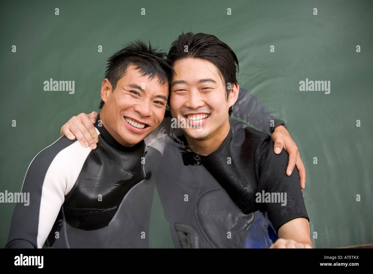 Portrait of two young men smiling Stock Photo - Alamy