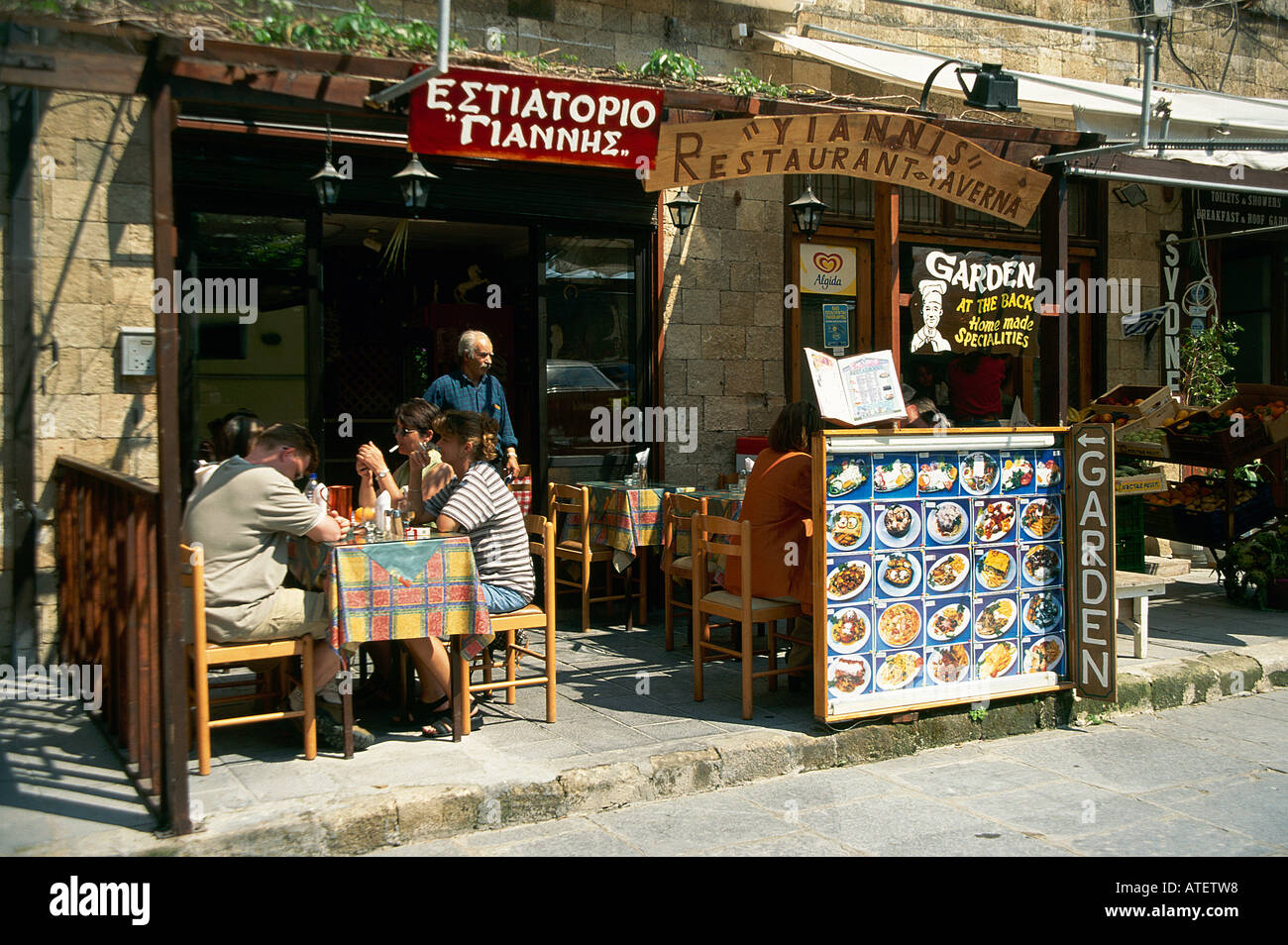 One of the many outdoor cafes in Rhodes Old Town Stock Photo - Alamy