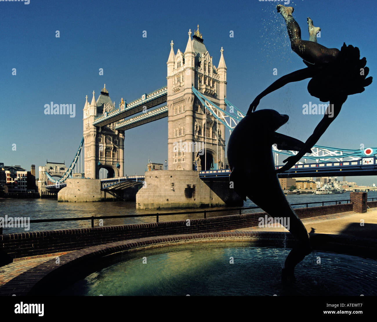 London England United Kingdom UK Tower Bridge and statue of swimmer ...