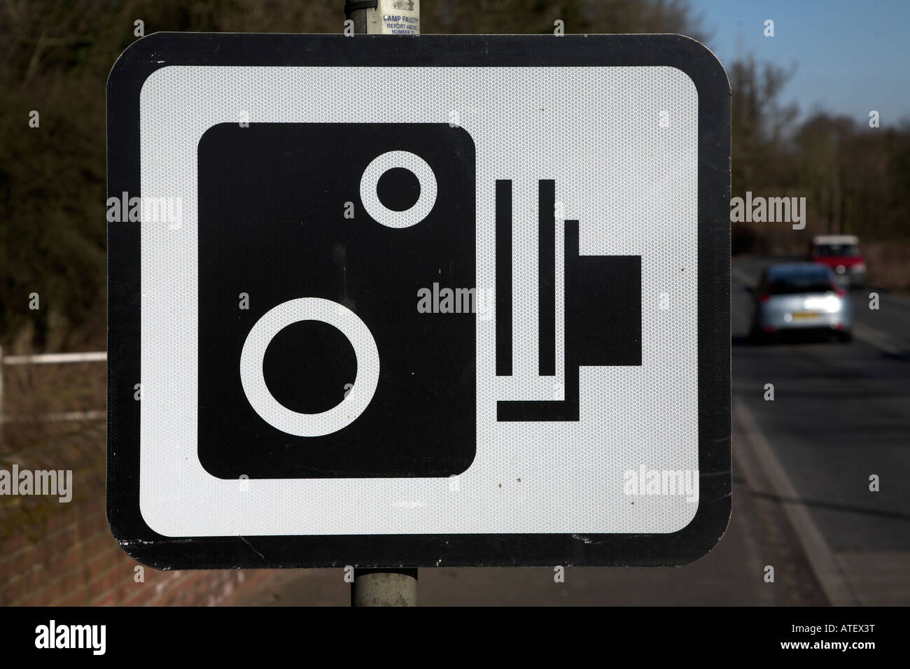 Roadside sign showing speed camera warning picture Stock Photo - Alamy