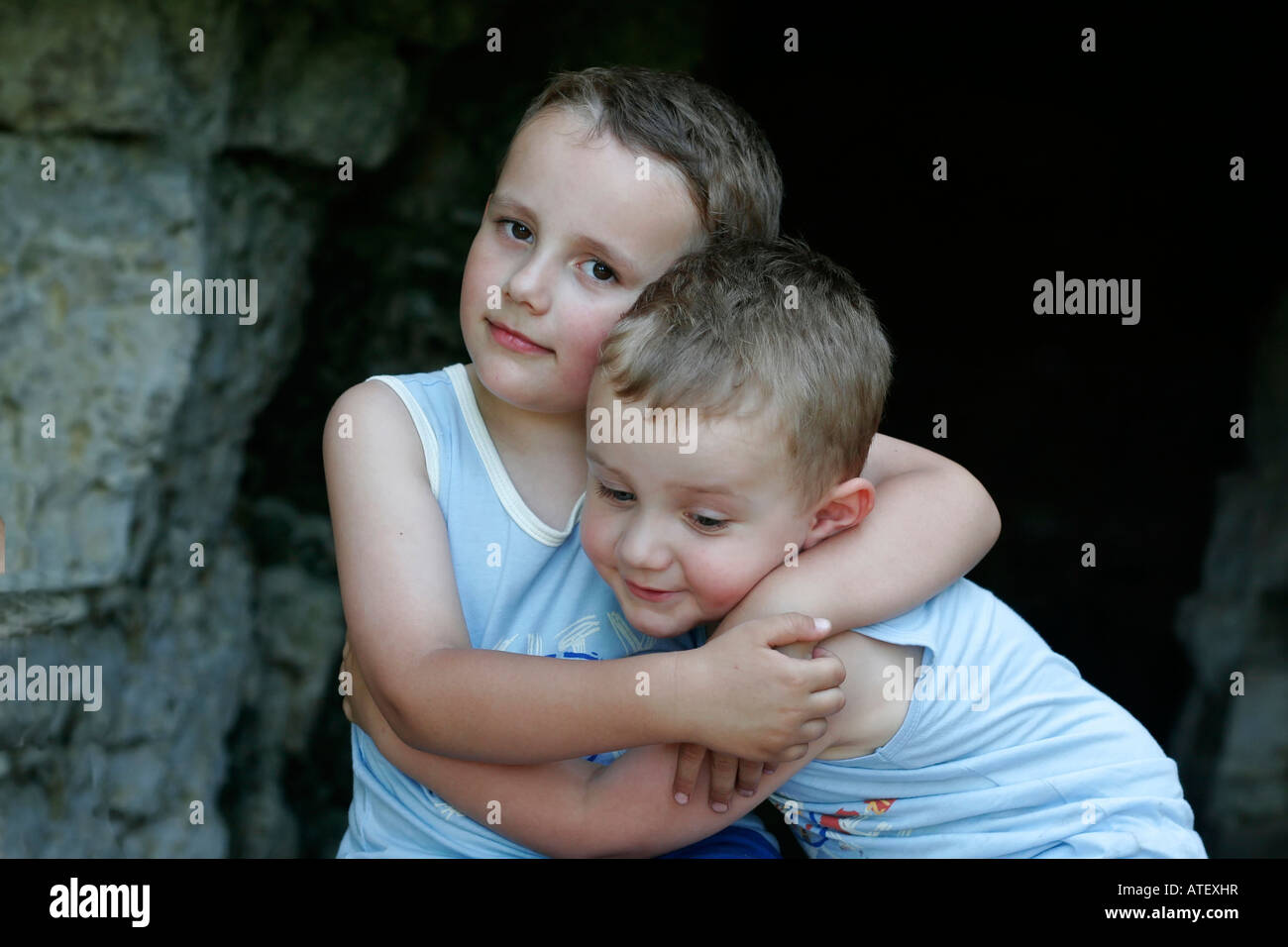 Two brothers (6-7, 8-9) embracing Stock Photo - Alamy