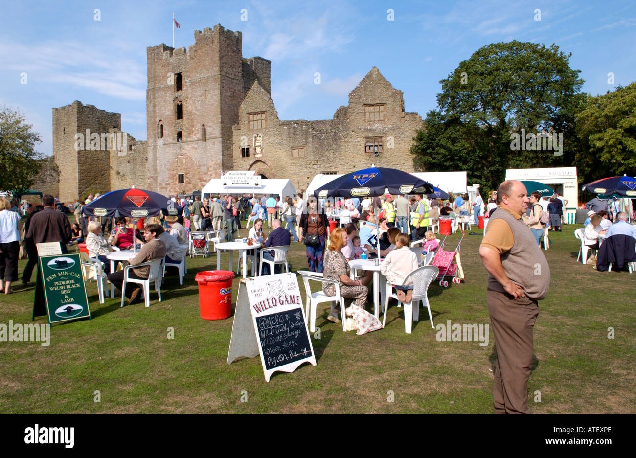 Visitors relax in castle grounds at the annual Ludlow Food Festival ...