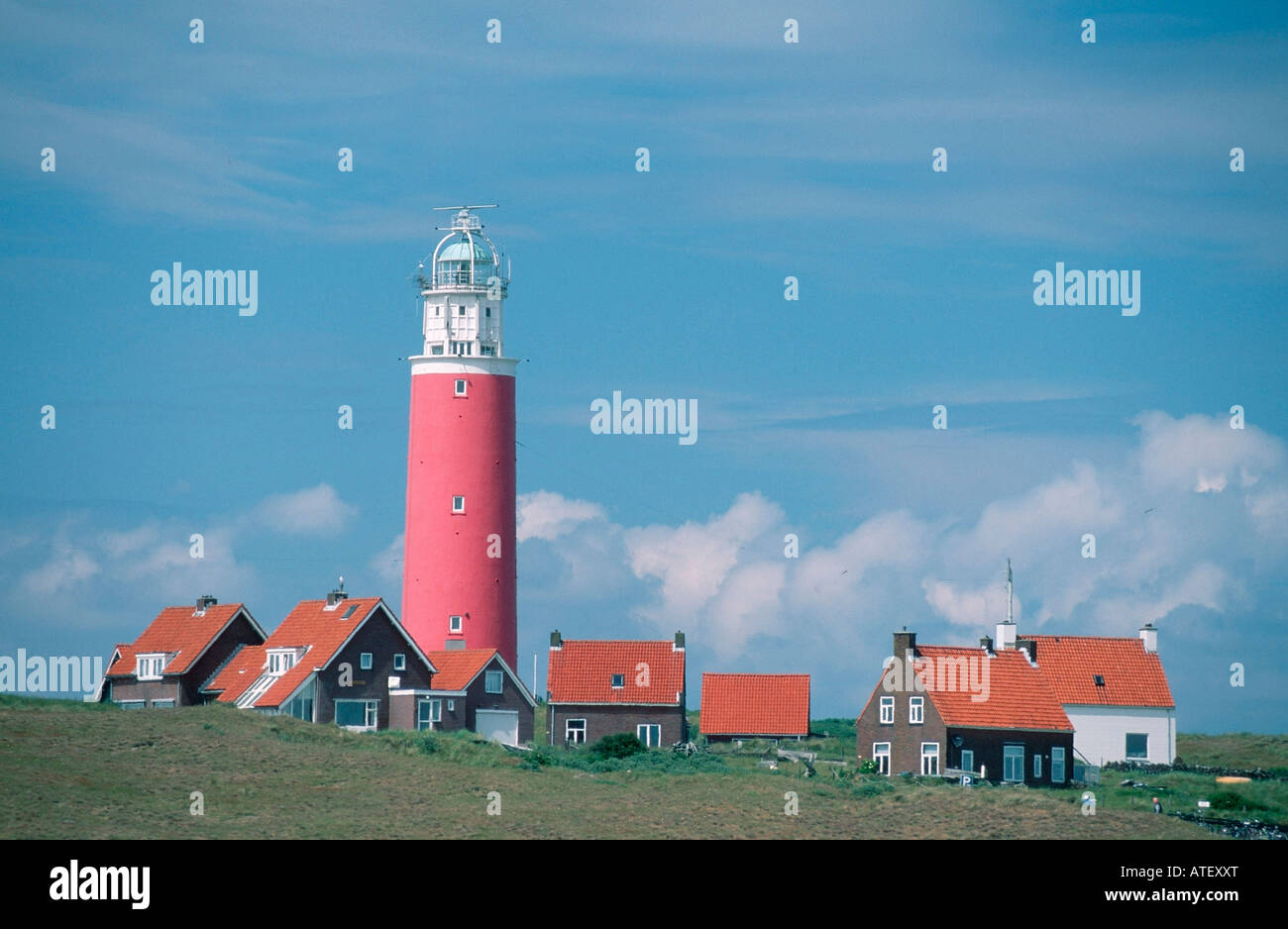 Lighthouse and houses Stock Photo - Alamy