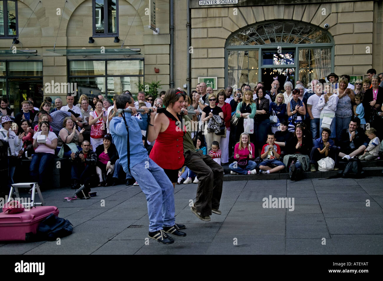 Strong lady lifting two men hi-res stock photography and images - Alamy