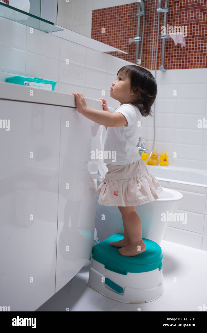 Child standing on potty Stock Photo - Alamy