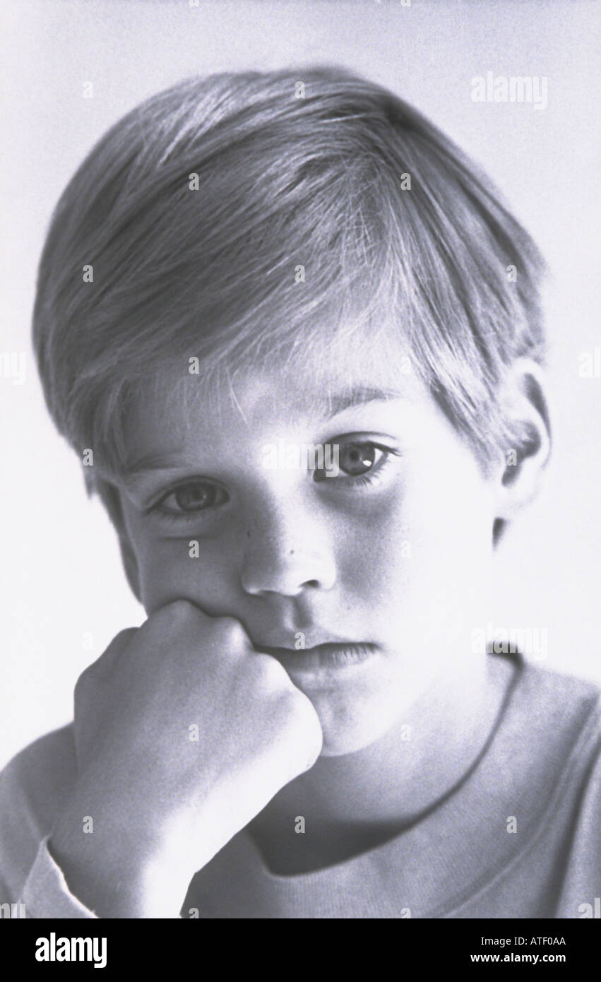 Portrait of melancholic boy hi-res stock photography and images - Alamy