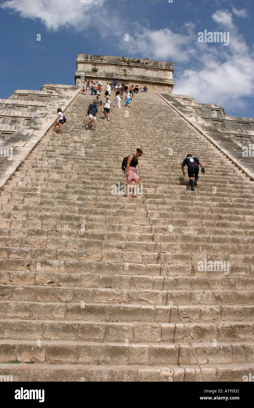 Coming down the steps at the big pyramid at the Mayan ruins at Chichén ...