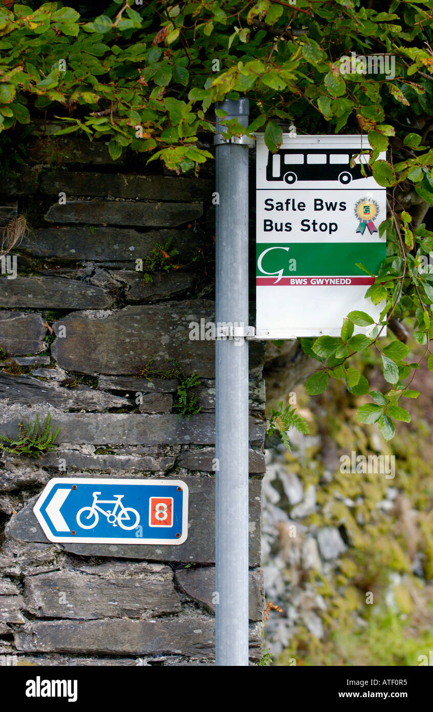 Rural Bus Stop with cycle route sign on slate wall near Corris Gwynedd ...