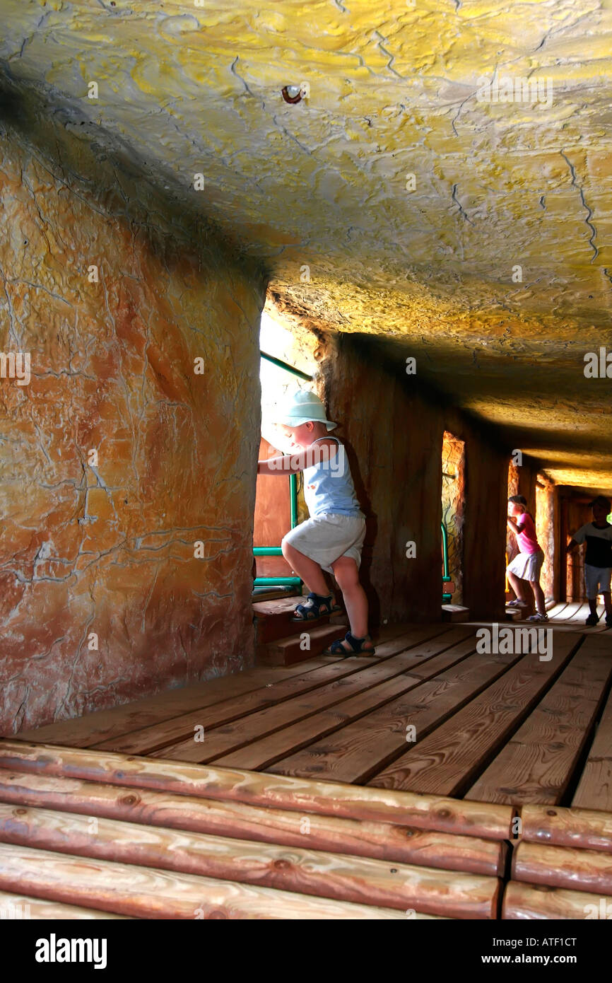 kids play in cave on playground Stock Photo - Alamy