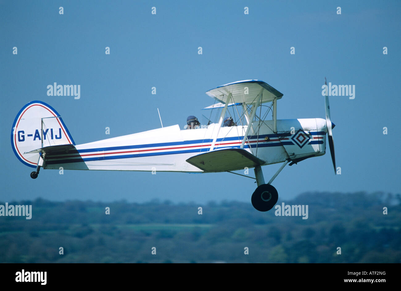 Biplane in Flight Stock Photo - Alamy