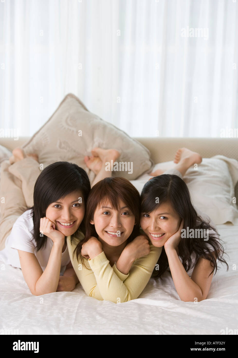 Portrait three sisters lying on hi-res stock photography and images - Alamy