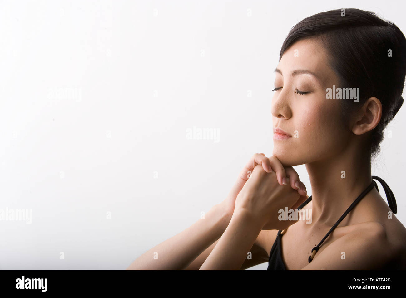 Woman closed eyes thinking hi-res stock photography and images - Alamy
