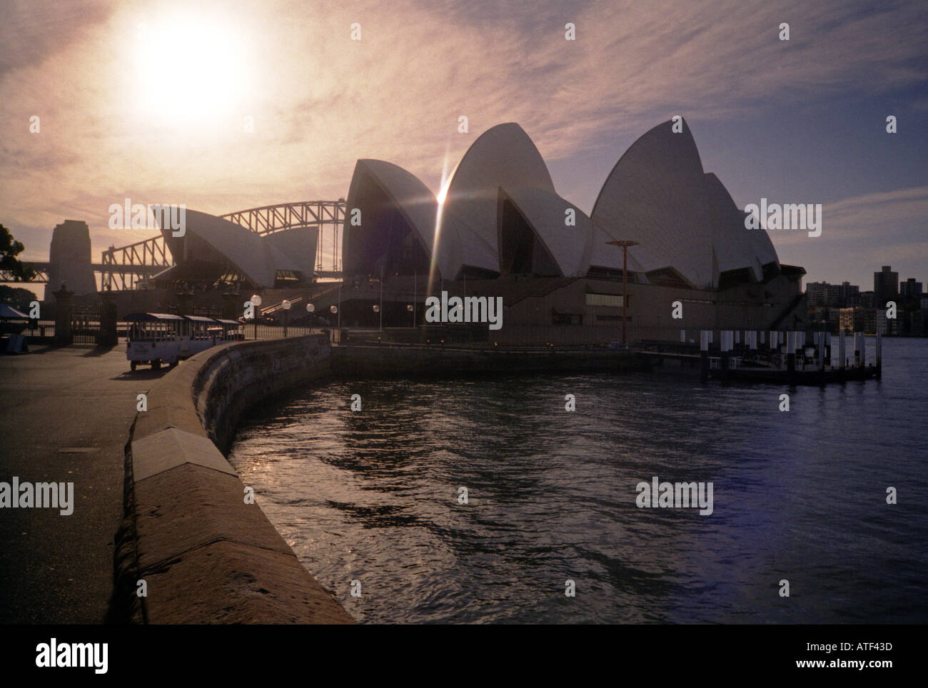 Waterscape cityscape sea futuristic modern spectacular sun Opera House ...