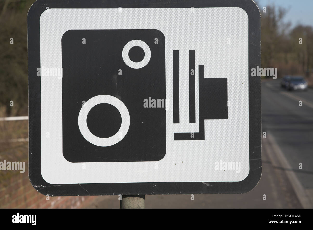 Roadside sign showing speed camera warning picture Stock Photo - Alamy