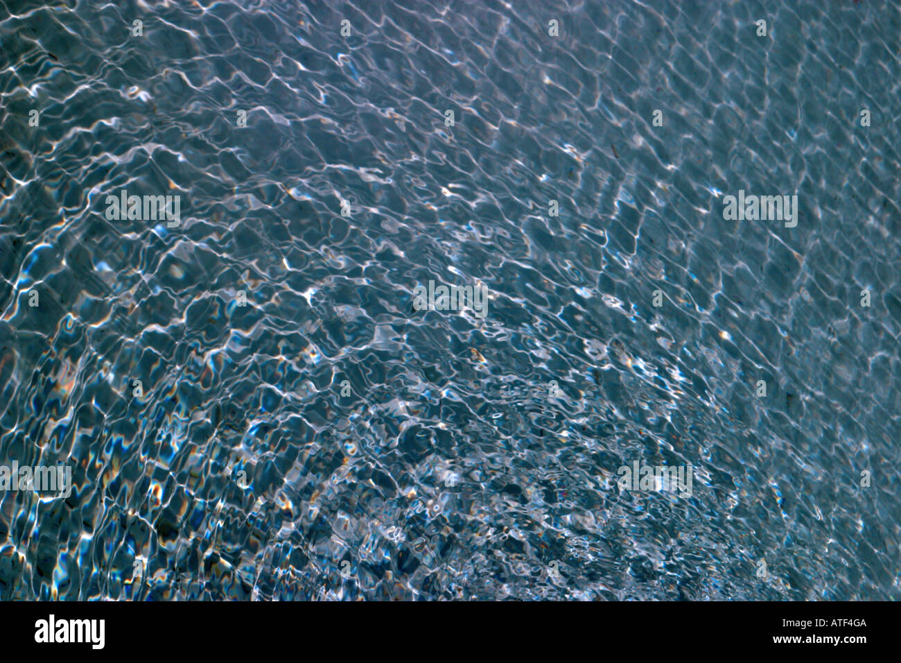 swimming pool water surface reflecting light Stock Photo - Alamy