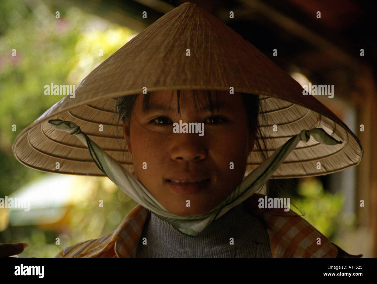 Powerful portrait of beautiful young Asian woman wearing a traditional ...