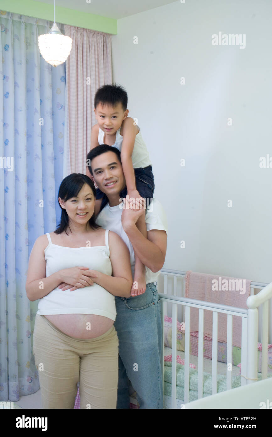 Portrait of parents and their son smiling Stock Photo - Alamy