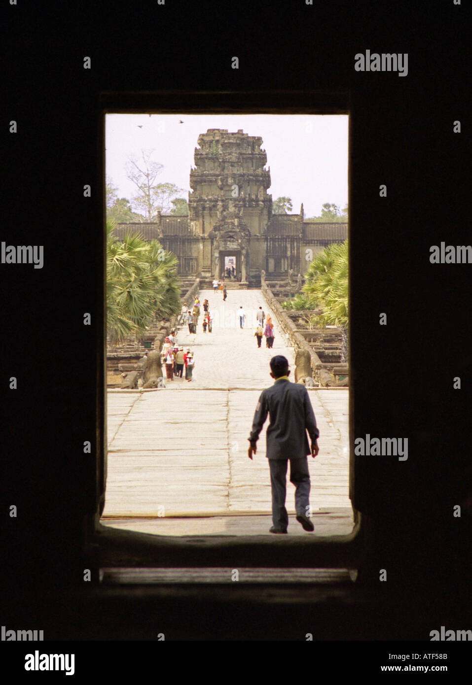 Entry door pathway to magnificent ancient Hindu temple people man woman ...