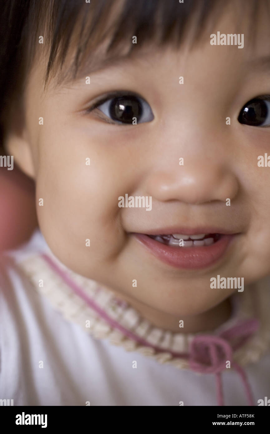 Portrait of a baby girl smiling Stock Photo - Alamy