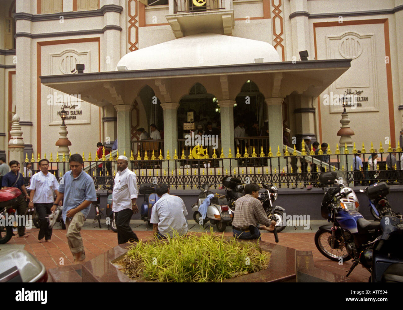 Panoramic view of typical lavish mosque entry in city centre man men ...