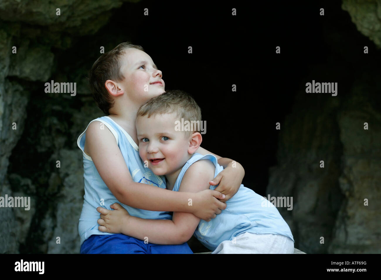 Two brothers (6-7, 8-9) embracing Stock Photo - Alamy